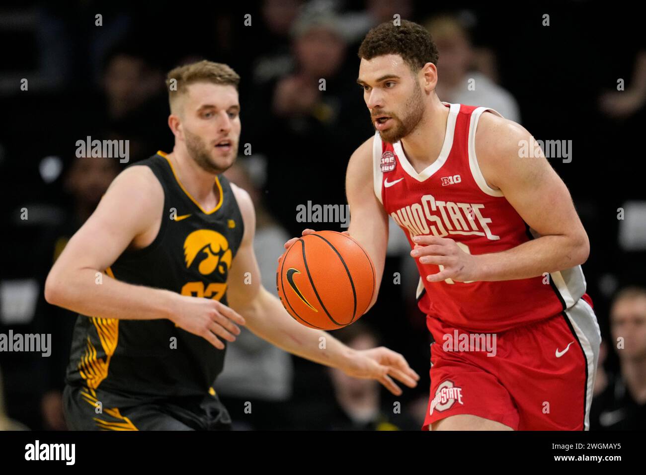 Ohio State forward Jamison Battle drvies past Iowa forward Ben Krikke ...