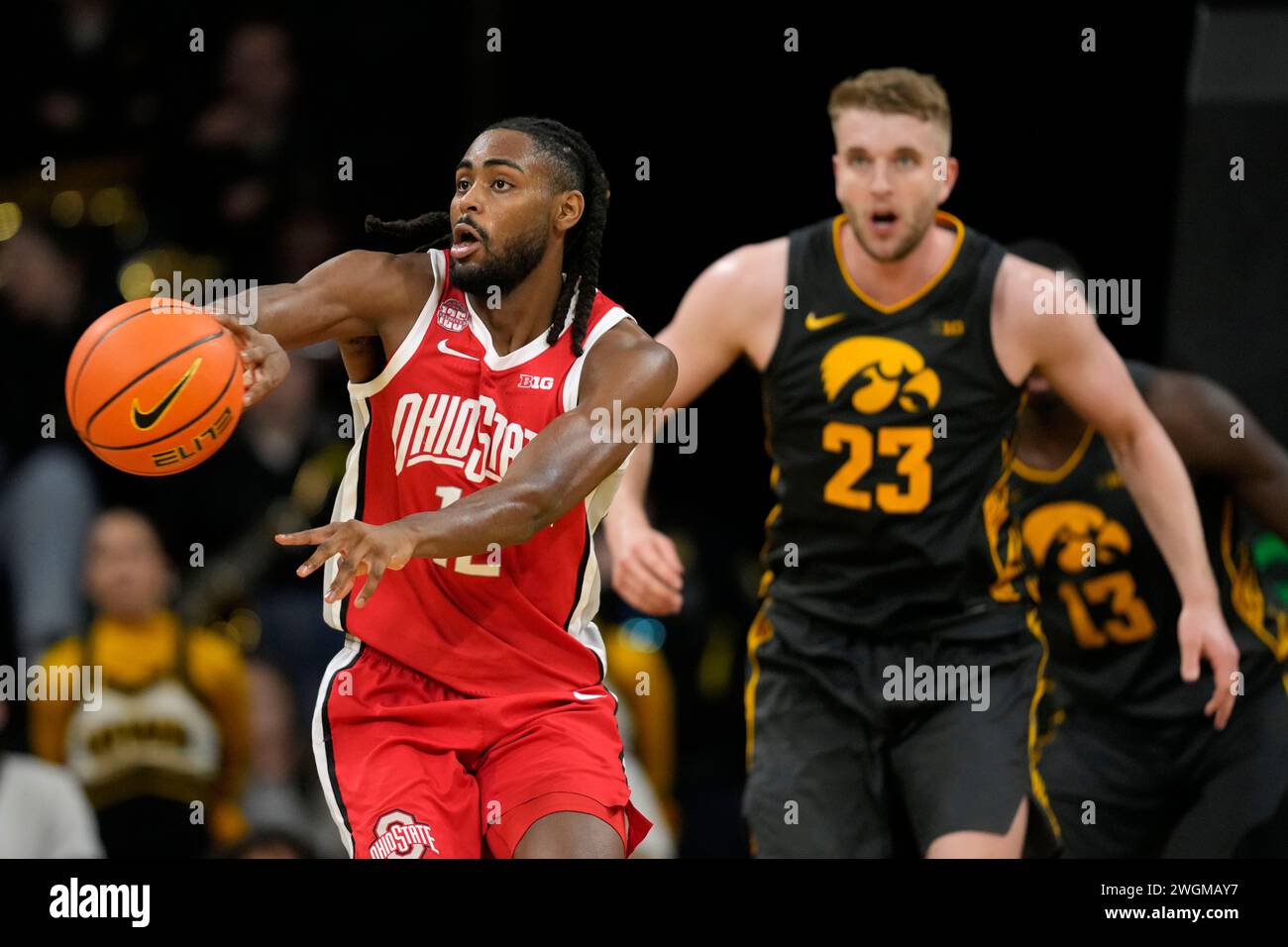 Ohio State guard Evan Mahaffey (12) passes in front of Iowa forward Ben ...