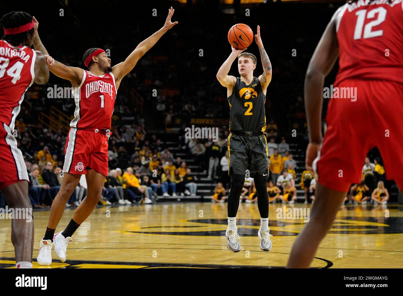 Iowa guard Brock Harding (2) shoots over Ohio State guard Roddy Gayle ...