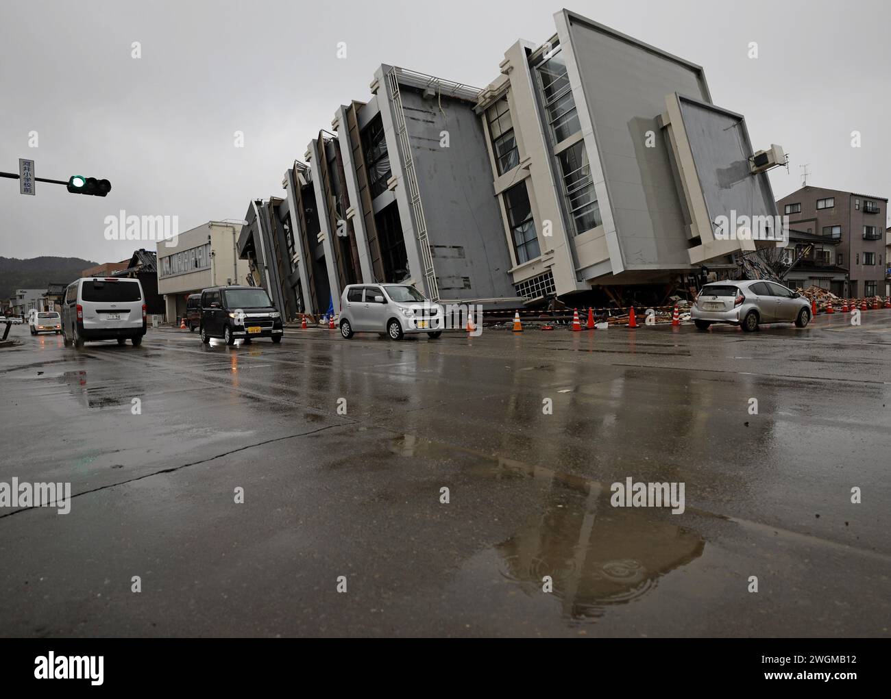 Photo taken on Feb. 5, 2024, shows a toppled building in Wajima in the ...