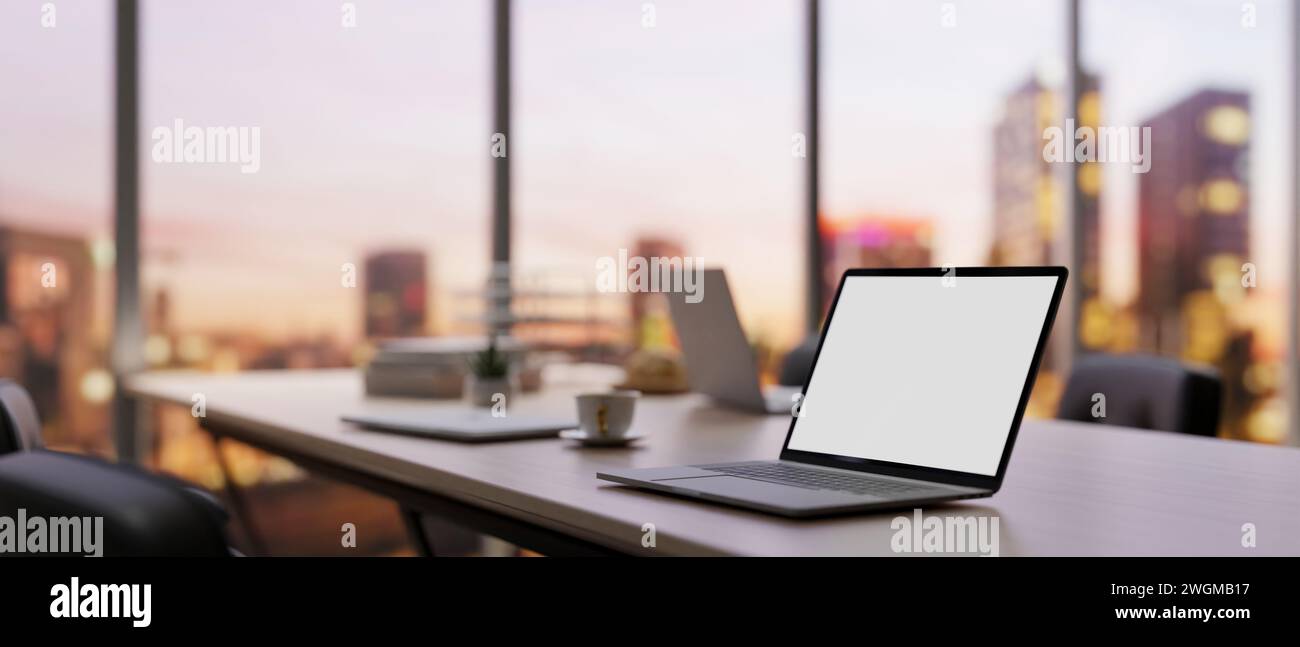 Close-up image of a laptop computer on a meeting table in a modern ...