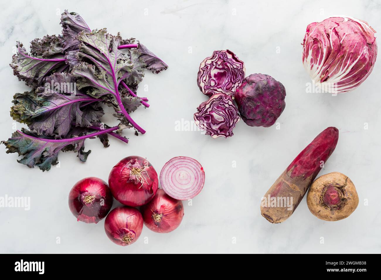 Groups of red and purple vegetables on a marble surface Stock Photo - Alamy