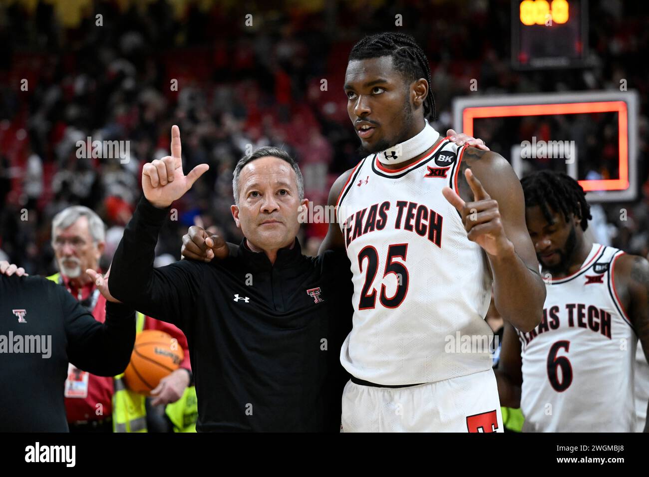 Texas Tech head coach Grant McCasland stands with Texas Tech forward ...