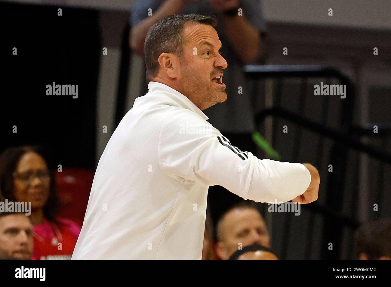 Louisville head coach Jeff Walz protests a call from the sideline ...