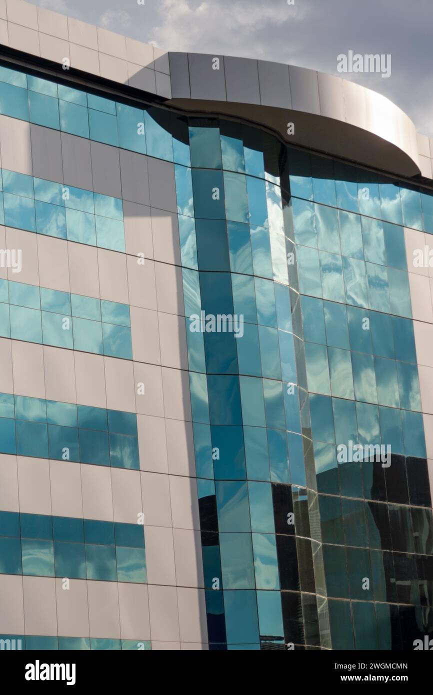 generic facade business building glass wall and windows, clouds ...