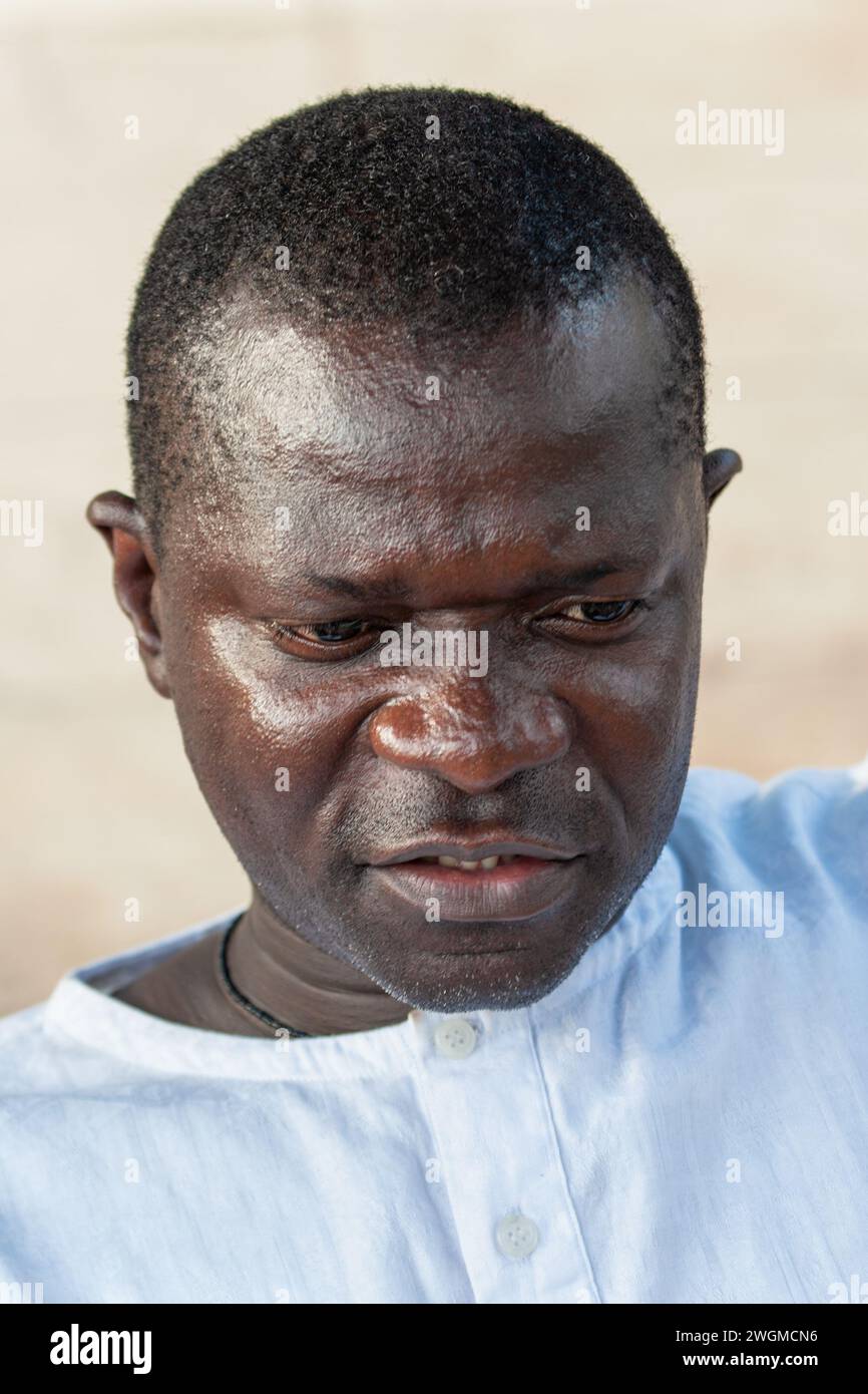 street photography, african man head and shoulders portrait, wearing ...