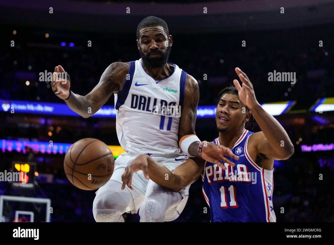 Dallas Mavericks' Kyrie Irving, left, and Philadelphia 76ers' Jaden ...