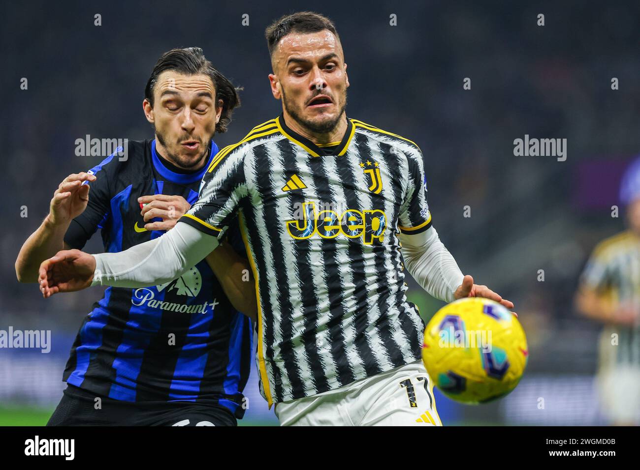 Milan, Italy. 04th Feb, 2024. Filip Kostic of Juventus FC (R) competes ...