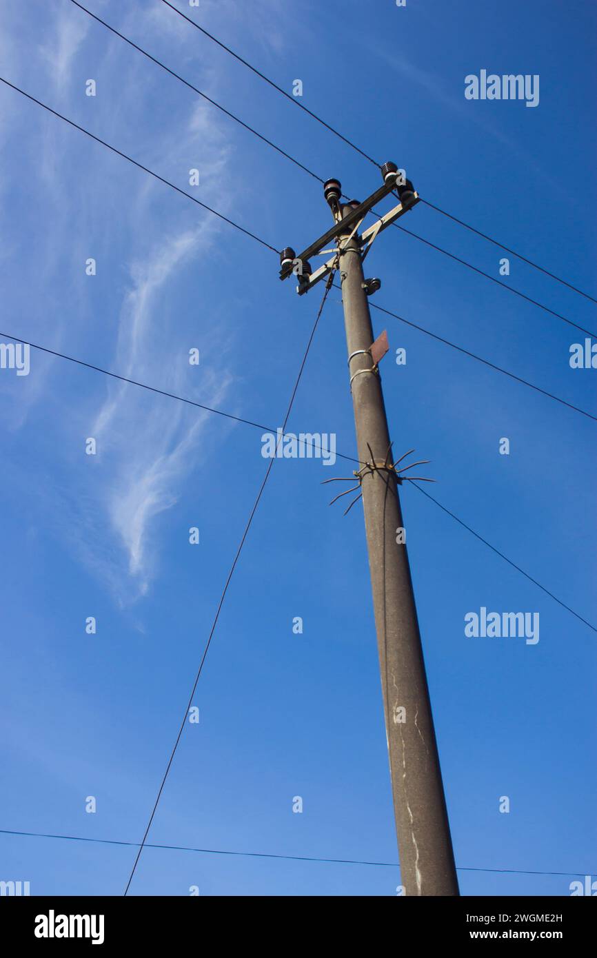 Photo of a high voltage power pole with a blue sky Stock Photo - Alamy