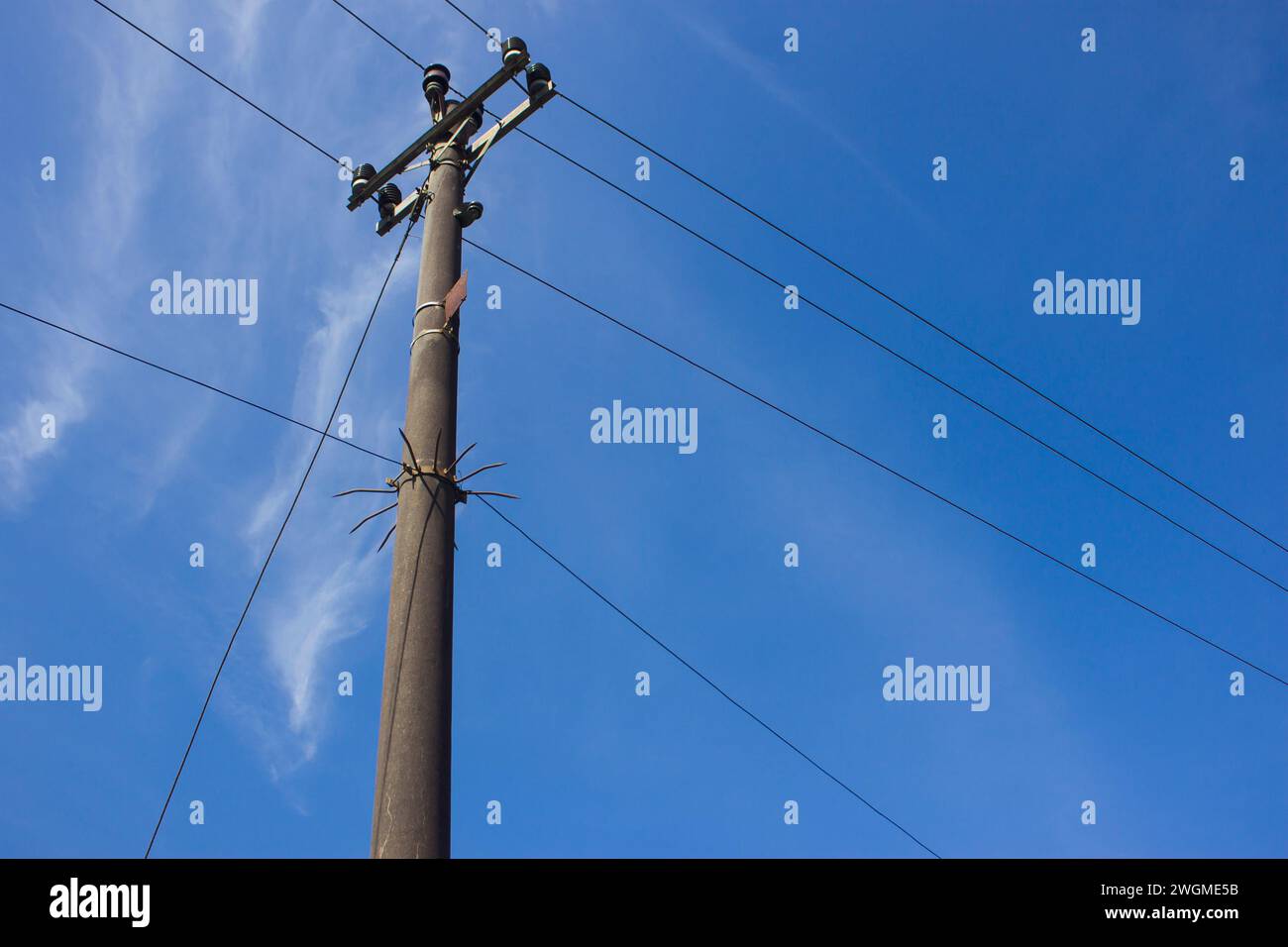 Photo of a high voltage power pole with a blue sky Stock Photo - Alamy