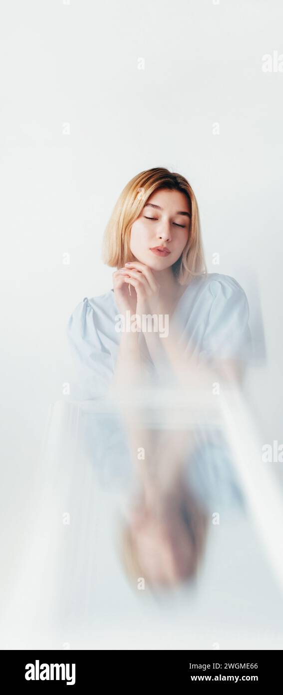 Dreamy mood inner peace woman mirror reflection Stock Photo - Alamy