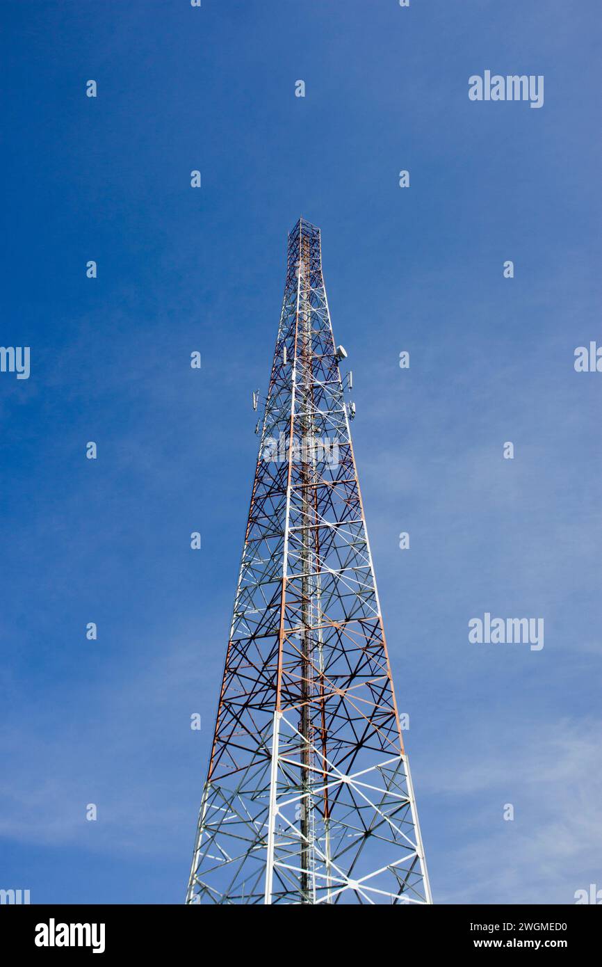 Photo of a high voltage power pole with a blue sky Stock Photo - Alamy
