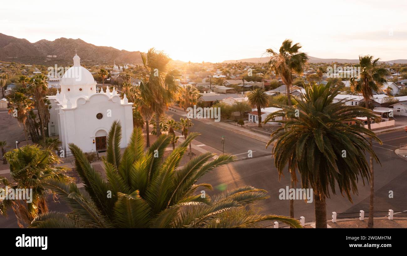 Aerial palm framed view of the historic downtown area of Ajo, Arizona ...