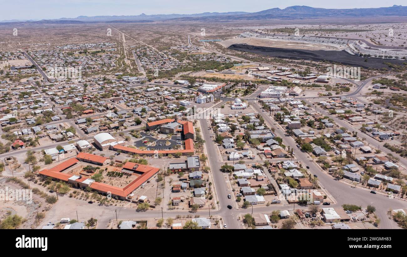Aerial palm framed view of the historic downtown area of Ajo, Arizona ...