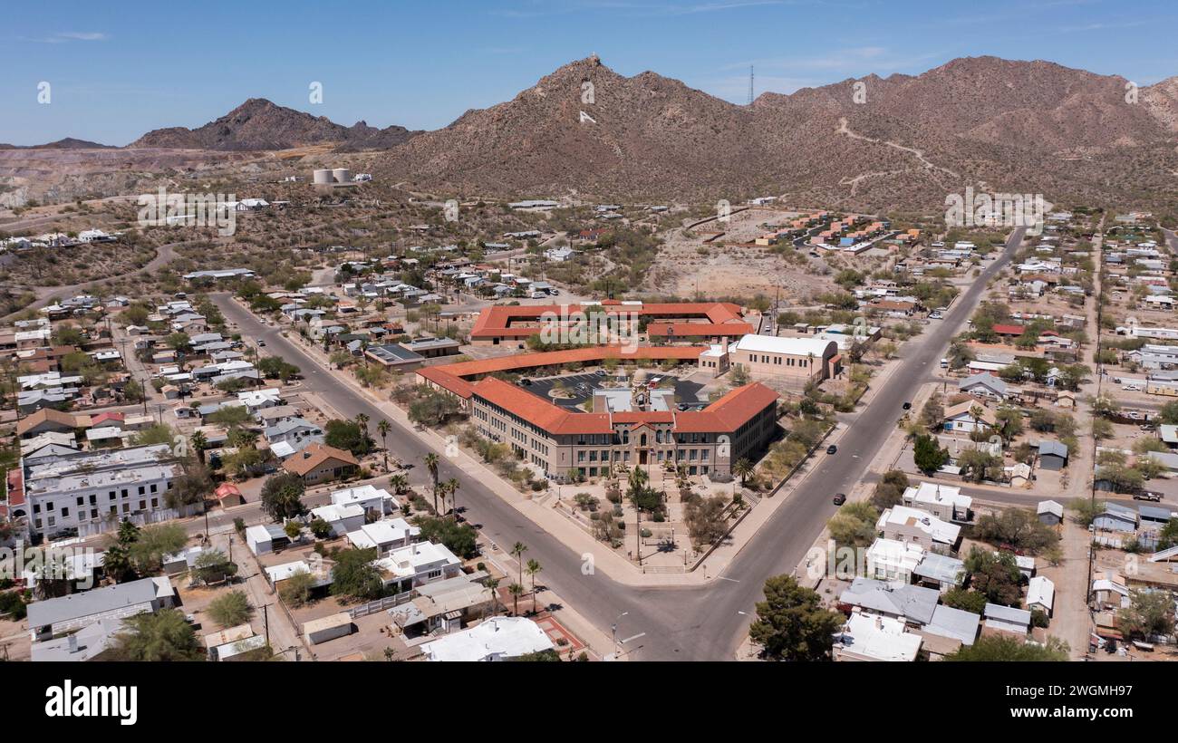 Aerial palm framed view of the historic downtown area of Ajo, Arizona ...