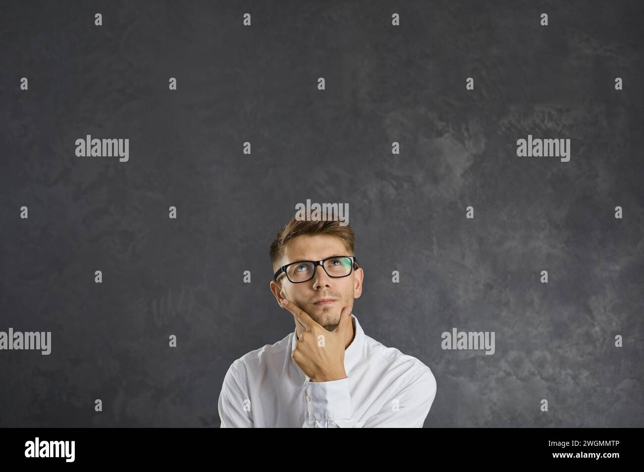 Portrait of confused and puzzled young man who is thinking carefully about something Stock Photo ...