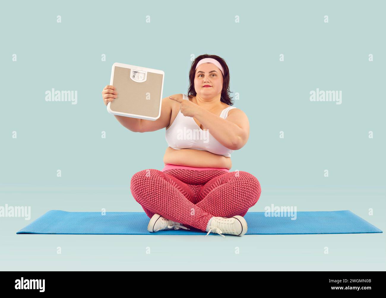 Chubby woman scale hi-res stock photography and images - Alamy