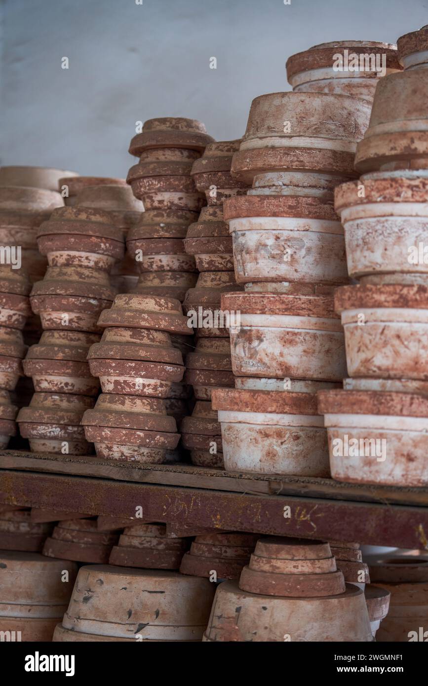 Neatly stacked clay embryos and molds in a traditional Chinese pottery ...