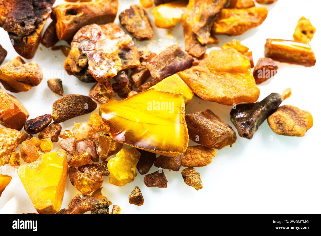 Yellow and orange raw amber pieces of different shapes. Raw materials ...