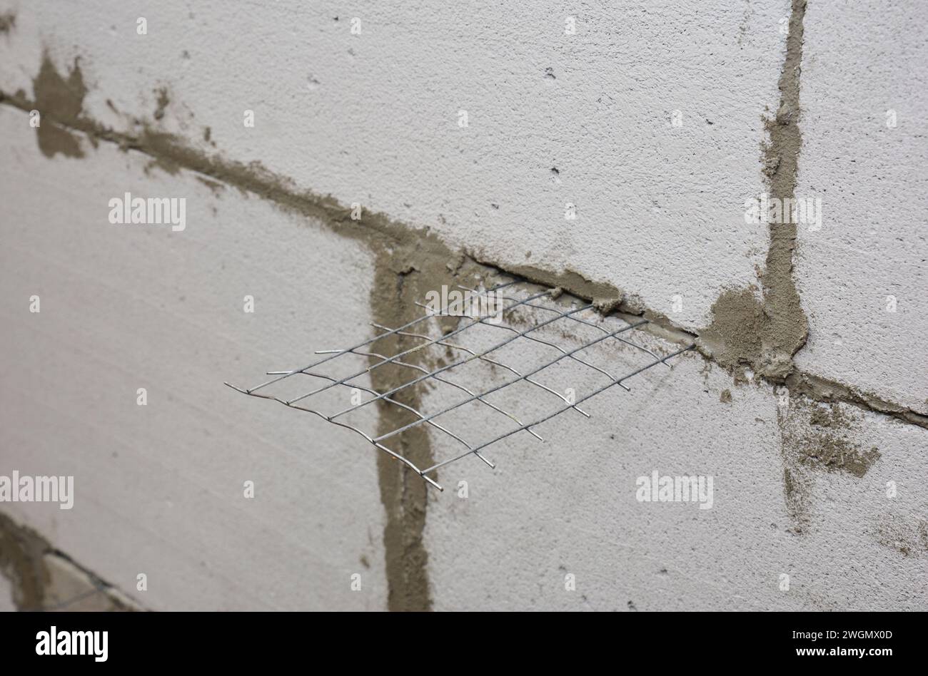Close up on autoclaved aerated concrete (AAC) wall with steel wire mesh ...