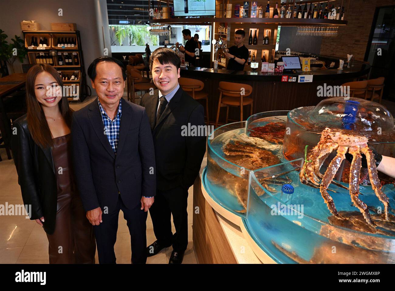 Dr Tan Kim Yong (centre), group chairman and chief executive of Hao Corp, a home-grown business ...