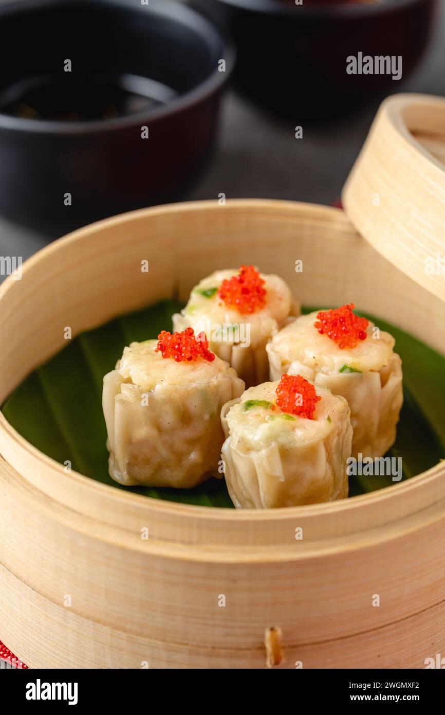 Shumai with shrimp and mushrooms, a traditional Chinese dumpling often ...