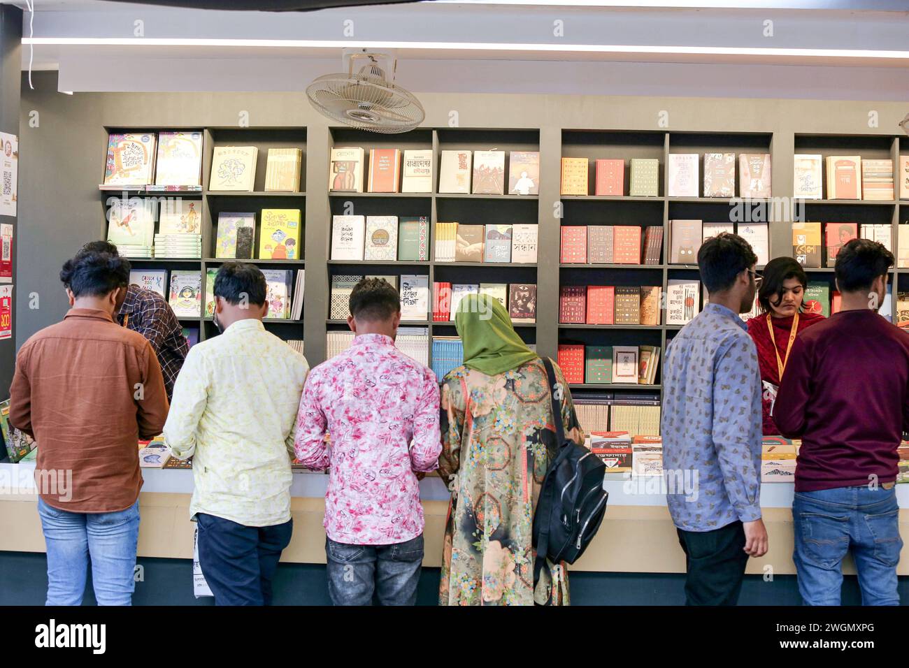 Buchmesse in Dhaka Visitors read books at the national book fair named Ekushey Boi Mela in Dhaka ...