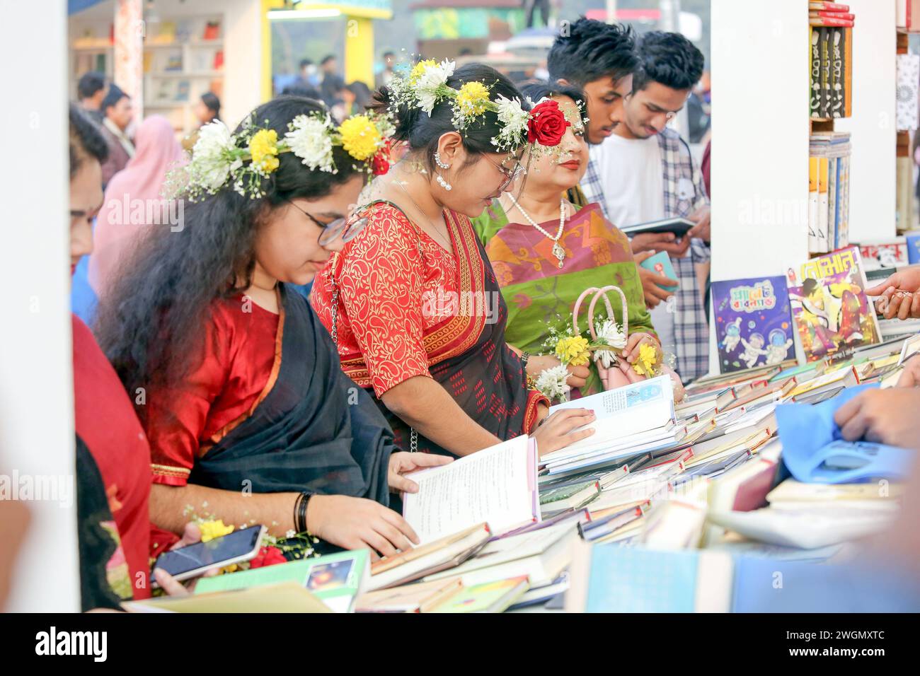Buchmesse in Dhaka Visitors read books at the national book fair named ...