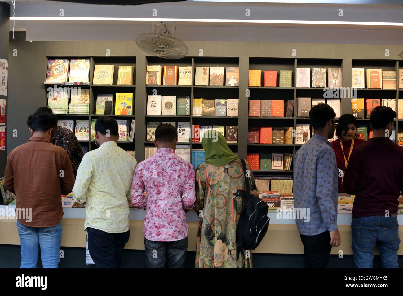 Dhaka, Bangladesh. 06th Feb, 2024. Visitors read books at the national book fair named Ekushey ...