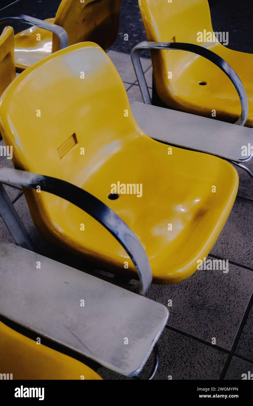 yellow sports stadium seating Stock Photo - Alamy