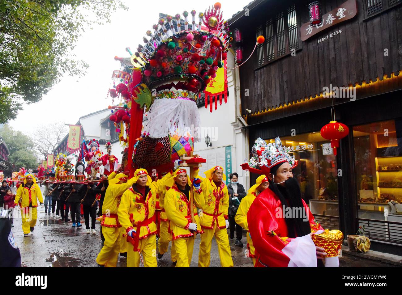 People take part in a folk parade to welcome the Spring Festival in ...