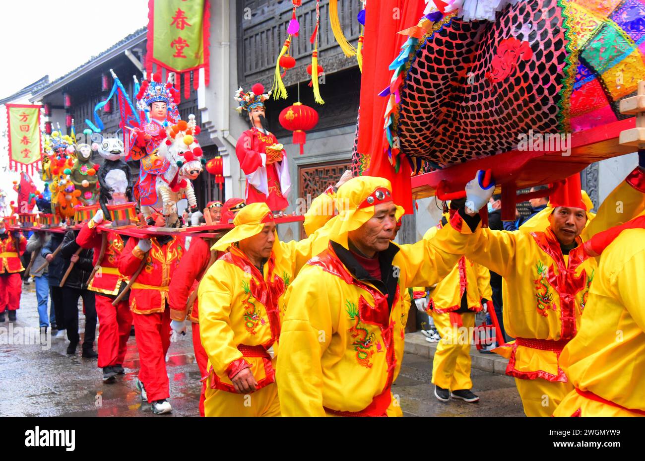 People take part in a folk parade to welcome the Spring Festival in ...
