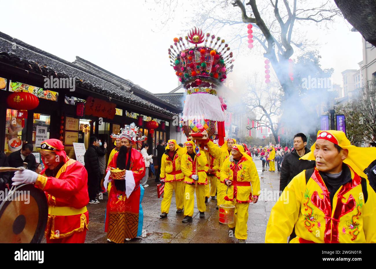 People take part in a folk parade to welcome the Spring Festival in ...