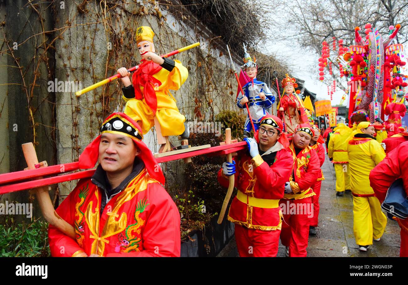 People take part in a folk parade to welcome the Spring Festival in ...