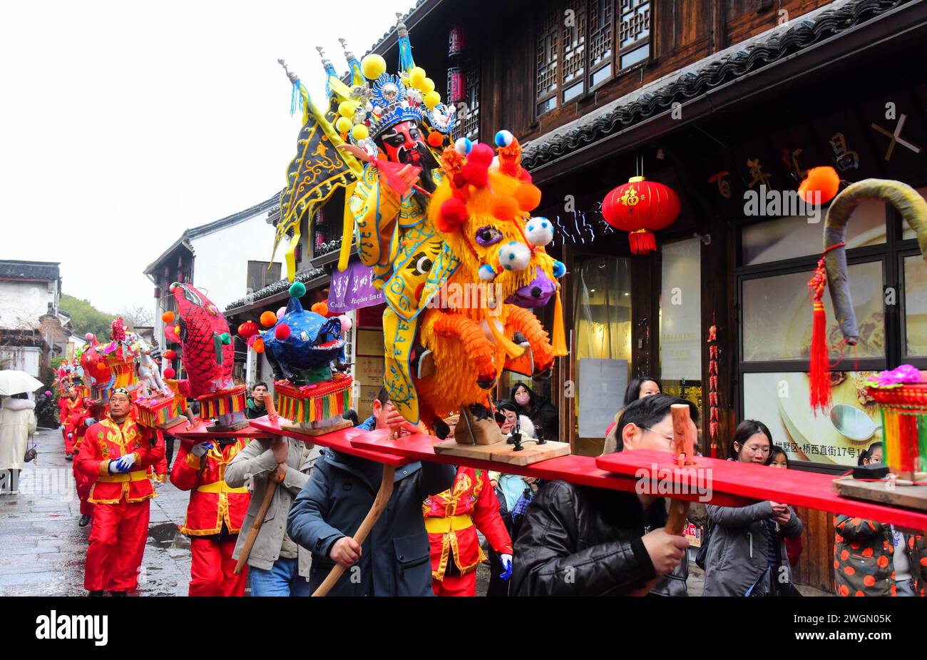 People take part in a folk parade to welcome the Spring Festival in ...