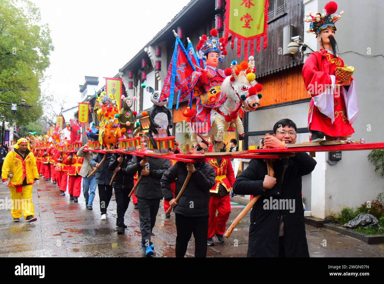 People take part in a folk parade to welcome the Spring Festival in ...