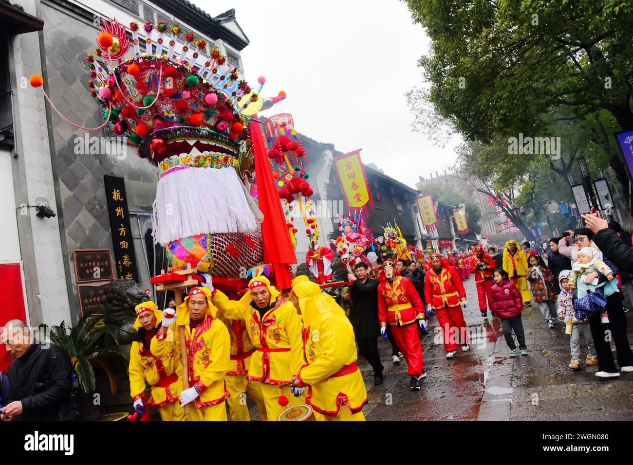 People take part in a folk parade to welcome the Spring Festival in ...