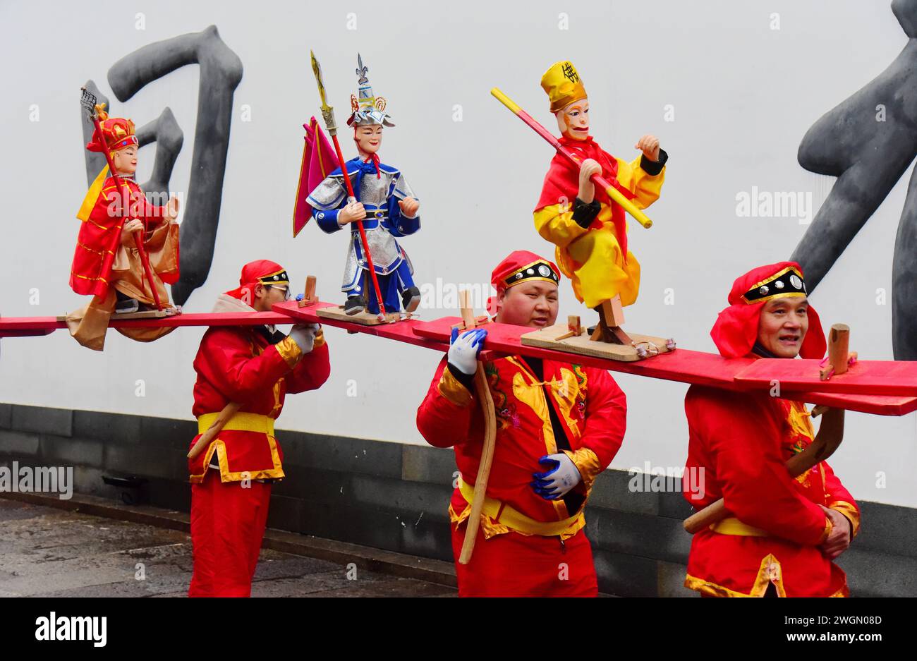 People take part in a folk parade to welcome the Spring Festival in ...