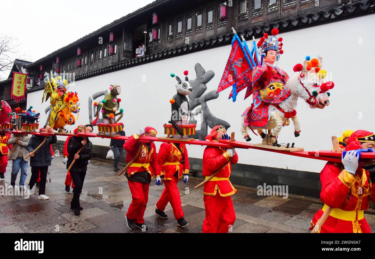 People take part in a folk parade to welcome the Spring Festival in ...