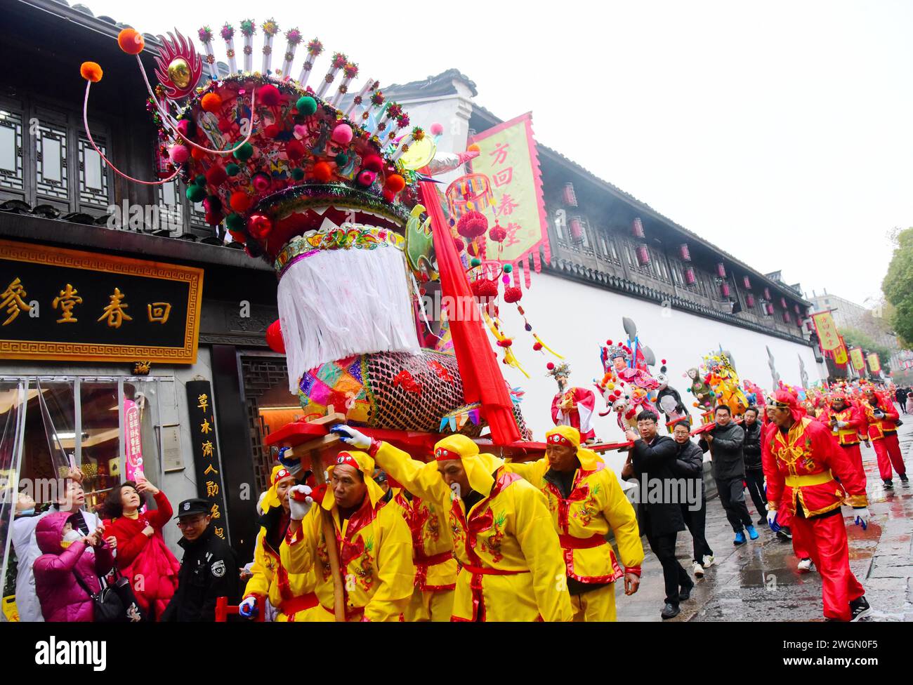 People take part in a folk parade to welcome the Spring Festival in ...