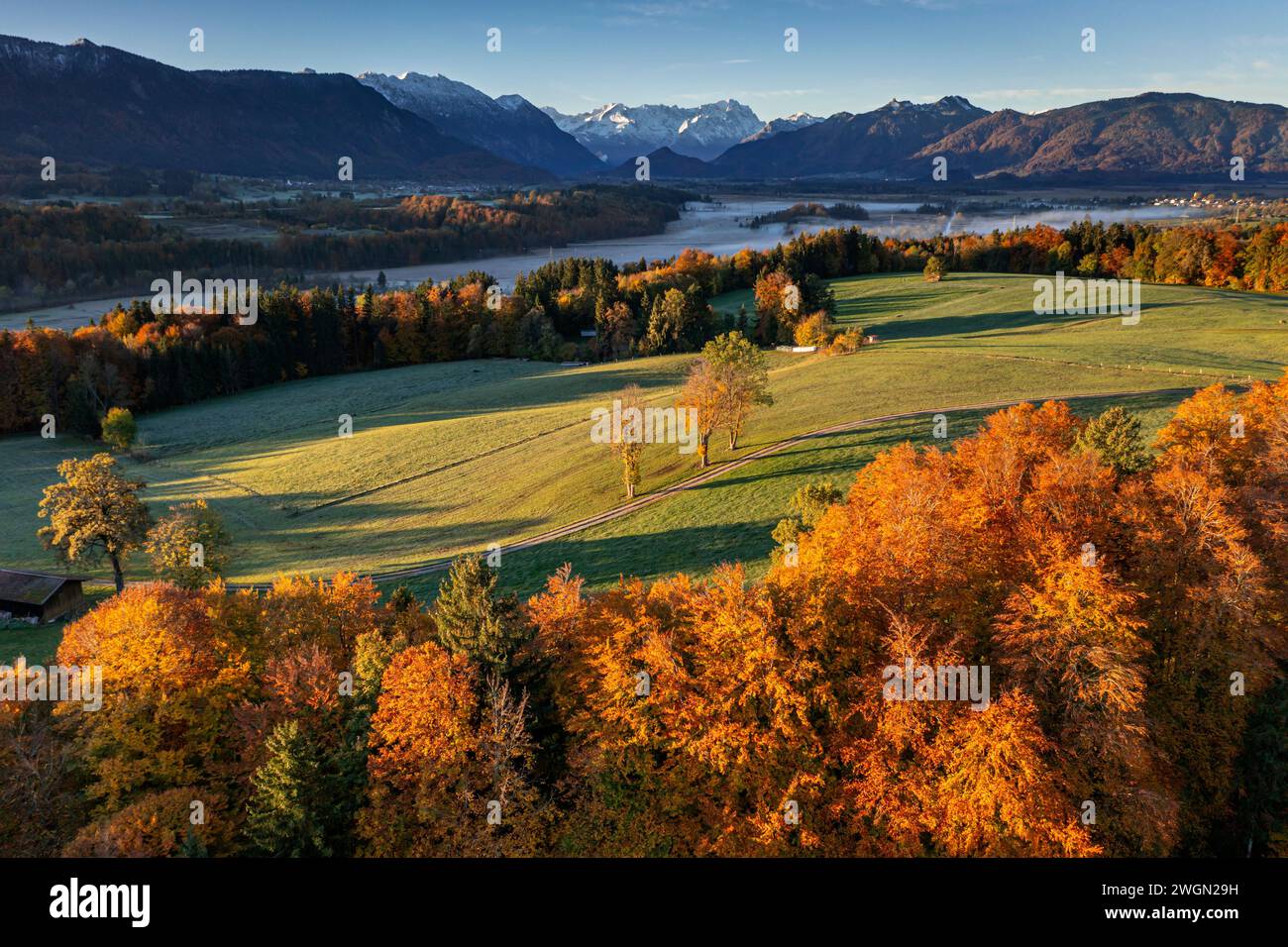Aerial view of mountain landscape, fall, forest, sunny, Murnau ...