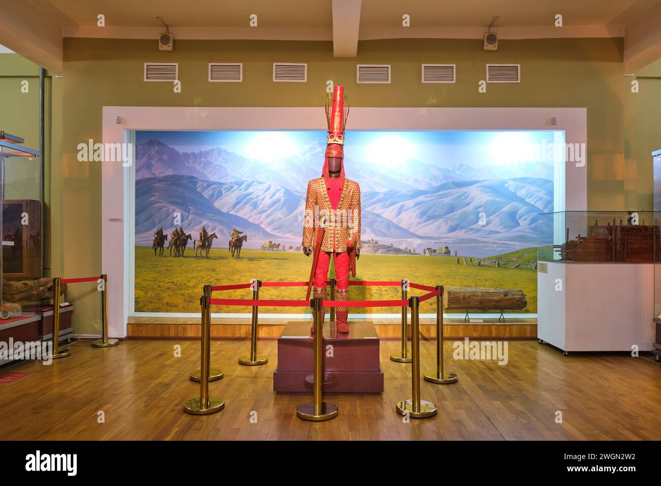 A display of a typical ancient warrior uniform, red and gold pattern ...