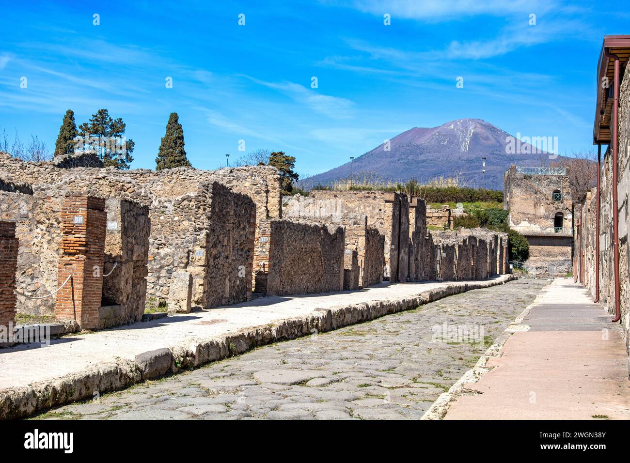 Street and buildings at the ancient Roman city of Pompeii, Italy. which ...