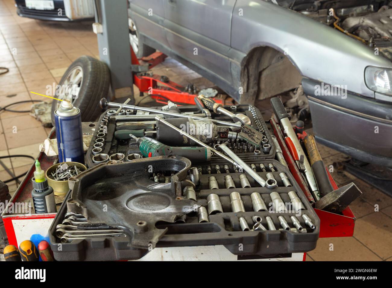 A Selective focus of mechanic's toolbox with tools in drawers. Spare ...