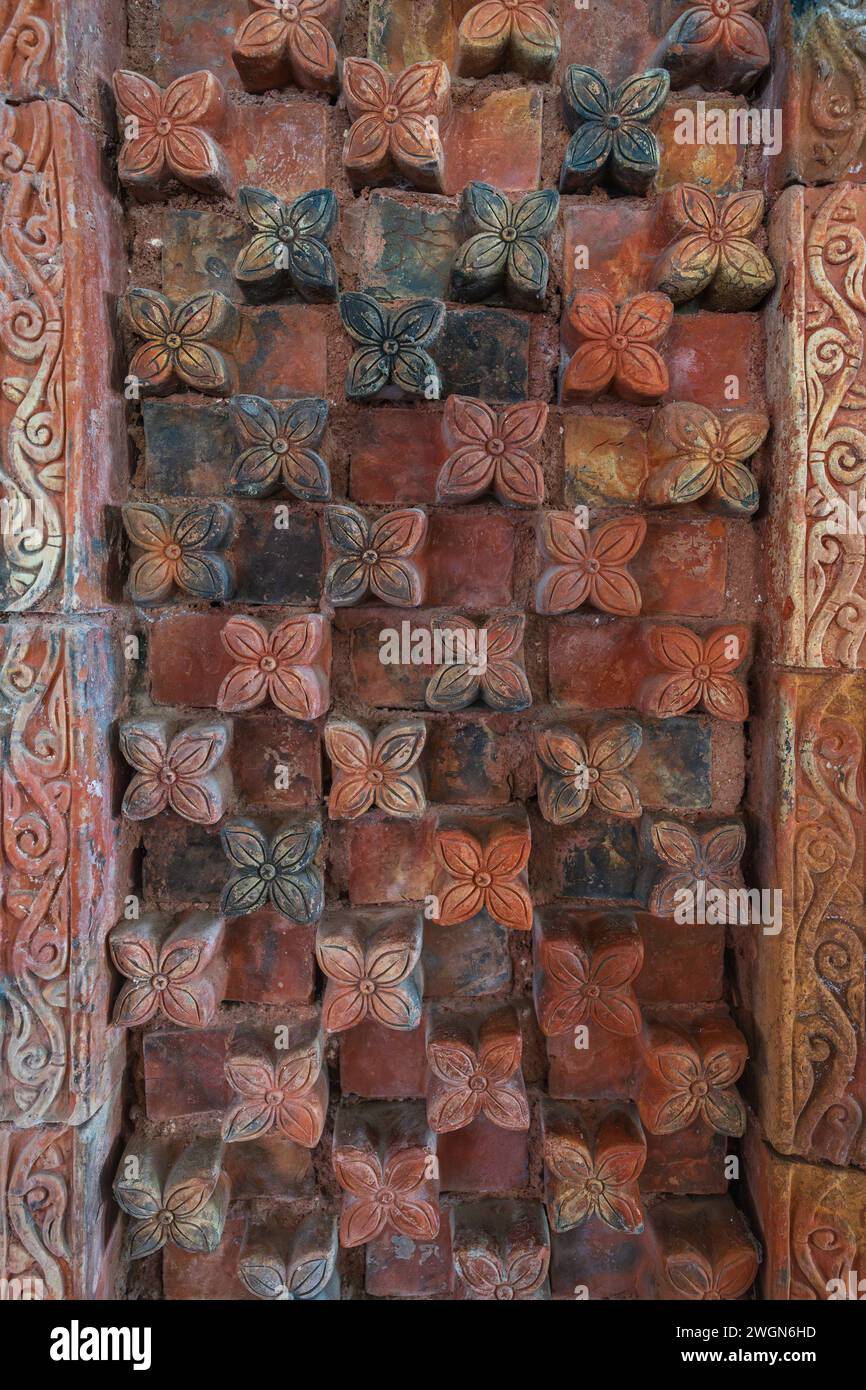 Closeup view of terracotta floral pattern on mirhab of ancient sixty ...