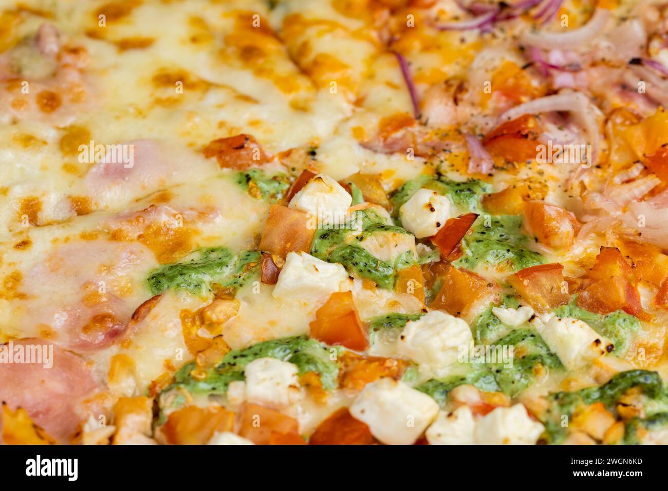 pizza using a large number of different ingredients close-up ...