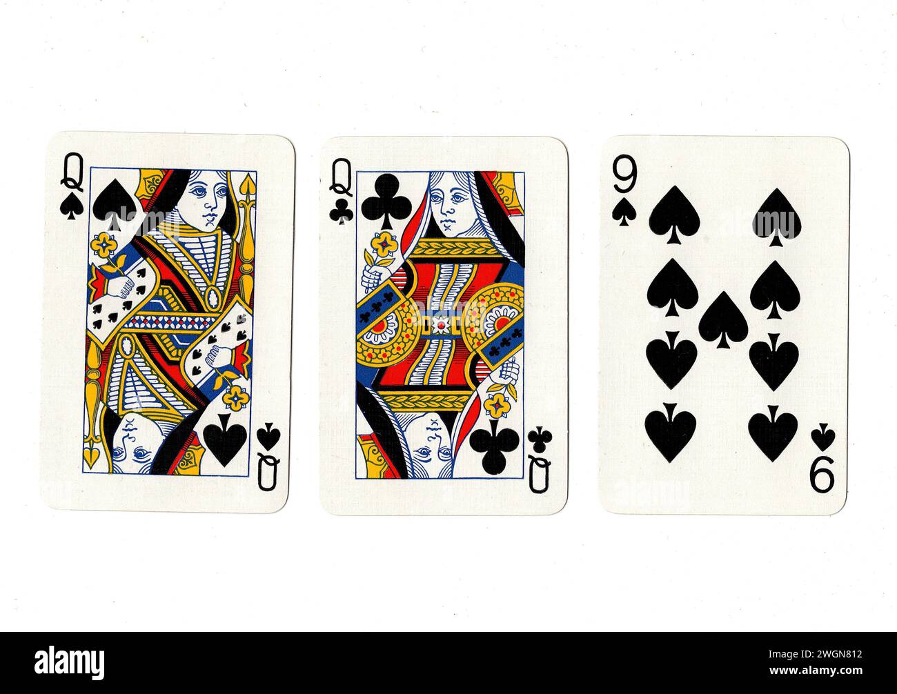 Vintage playing cards showing a pair of black queens and a black nine ...
