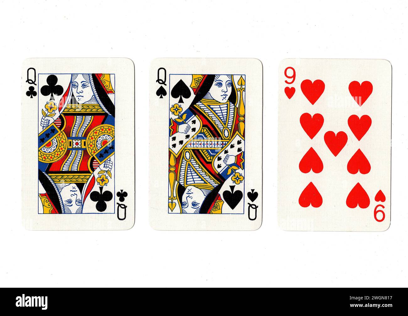 Vintage playing cards showing a pair of black queens and a red nine ...