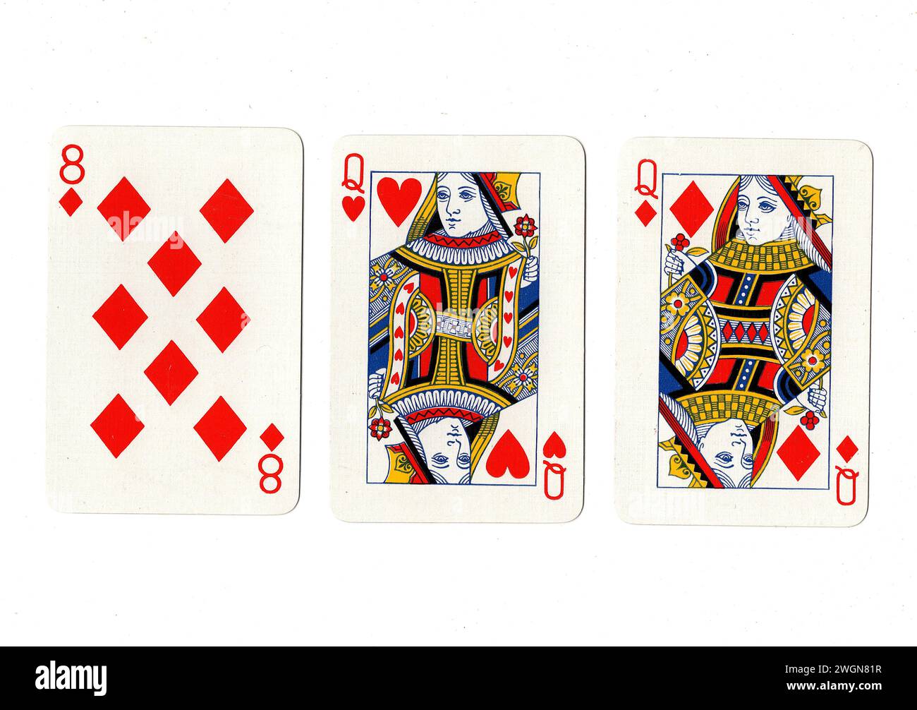 Vintage playing cards showing a pair of red queens and a red eight ...