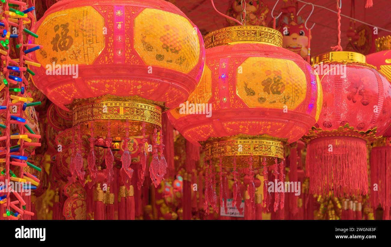 People shop Spring Festival decorations at a market in Shenzhen City ...